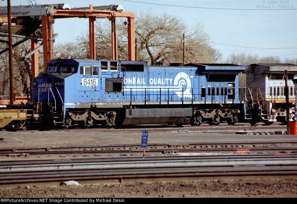 Still wearing Conrail paint, NS C40-8W #8416 is the last of a 4 unit consist on a BNSF eastbound ...